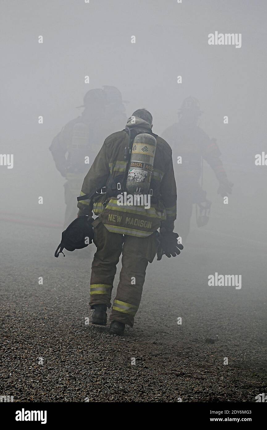 Rear View Of Firefighters Outdoors Stock Photo - Alamy