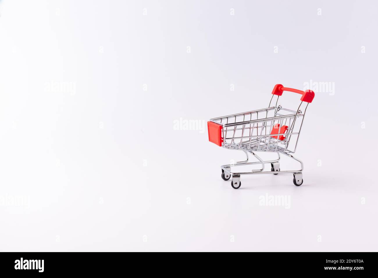 red supermarket mini trolley Stock Photo - Alamy