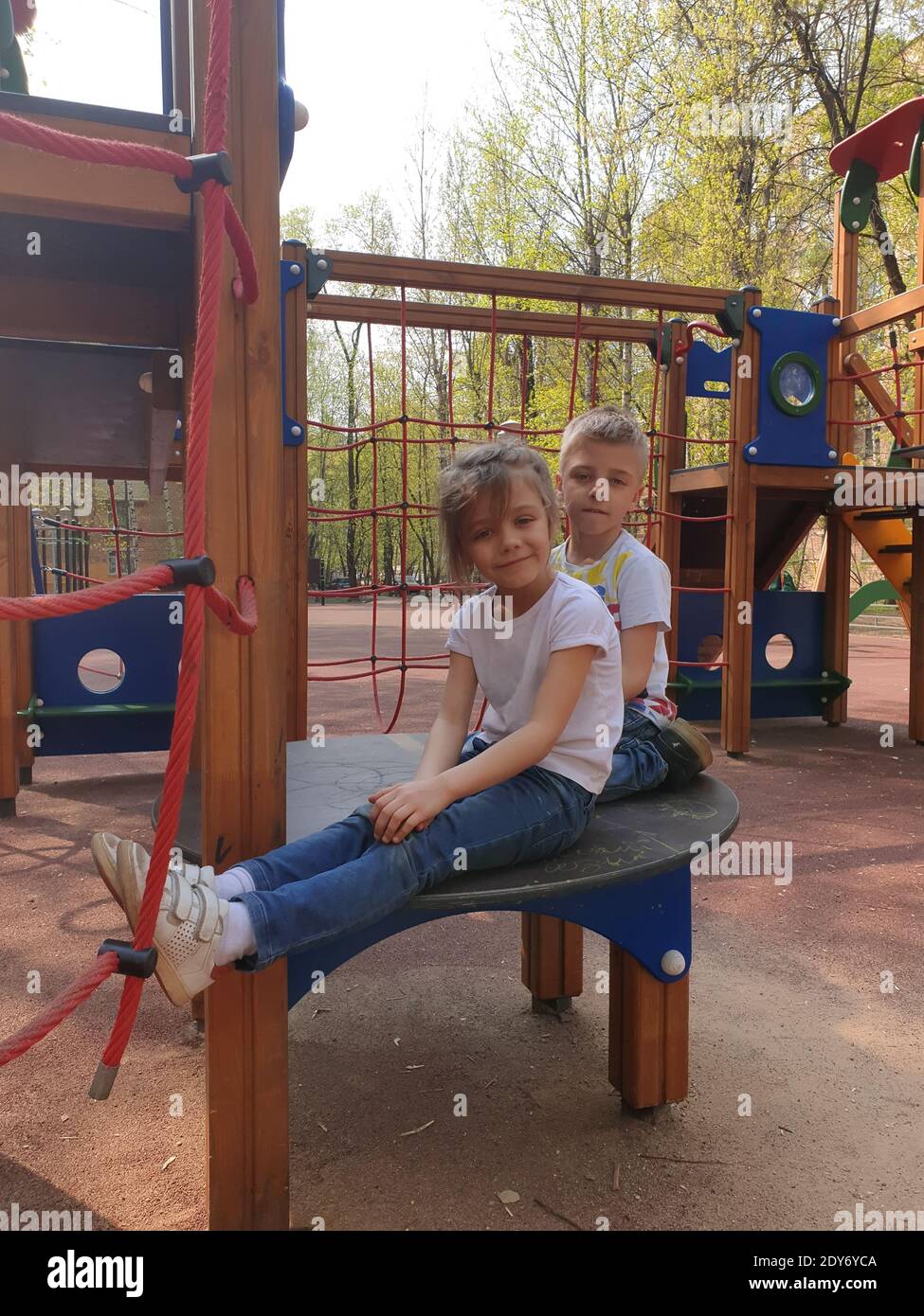 Children Playing On Slide At Playground Stock Photo - Alamy
