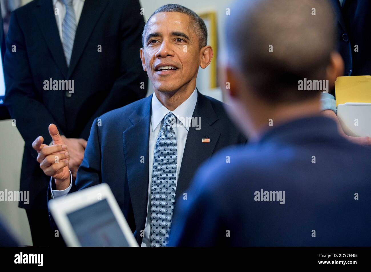 U.S. President Barack Obama talks to middle-school students who are ...