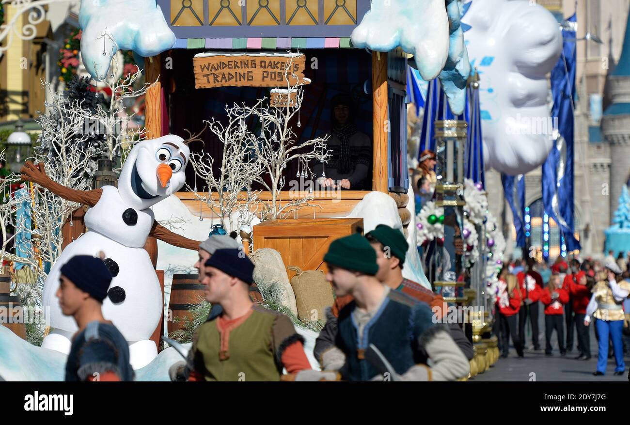 Olaf, from the animated hit film Frozen, waves to Magic Kingdom guests ...