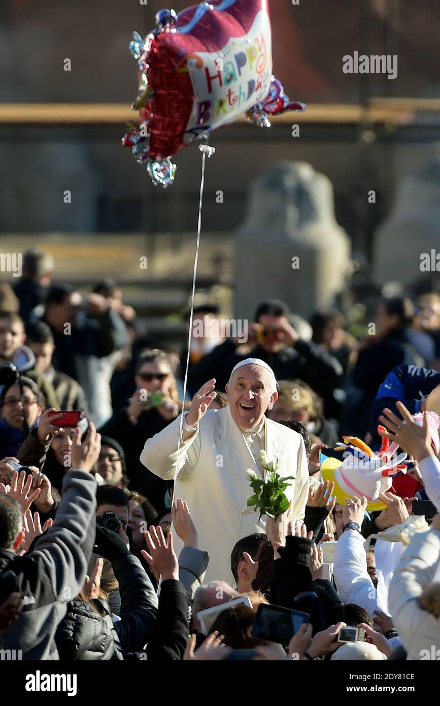 Pope Francis passes by a balloon reading Happy Birthday as he arrives ...