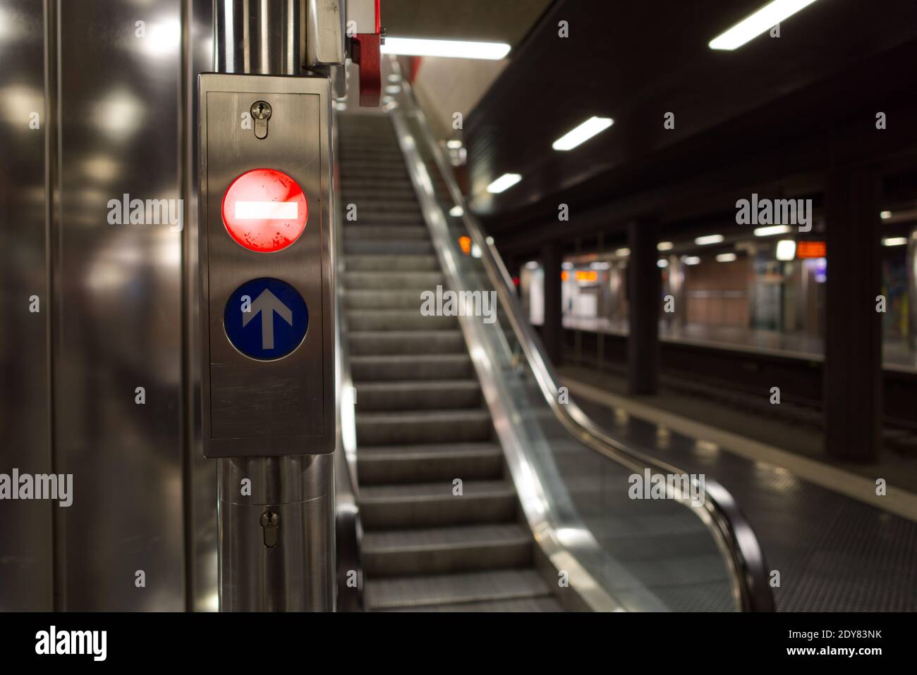 Selective focus at no entry and up signal light in front of escalator ...