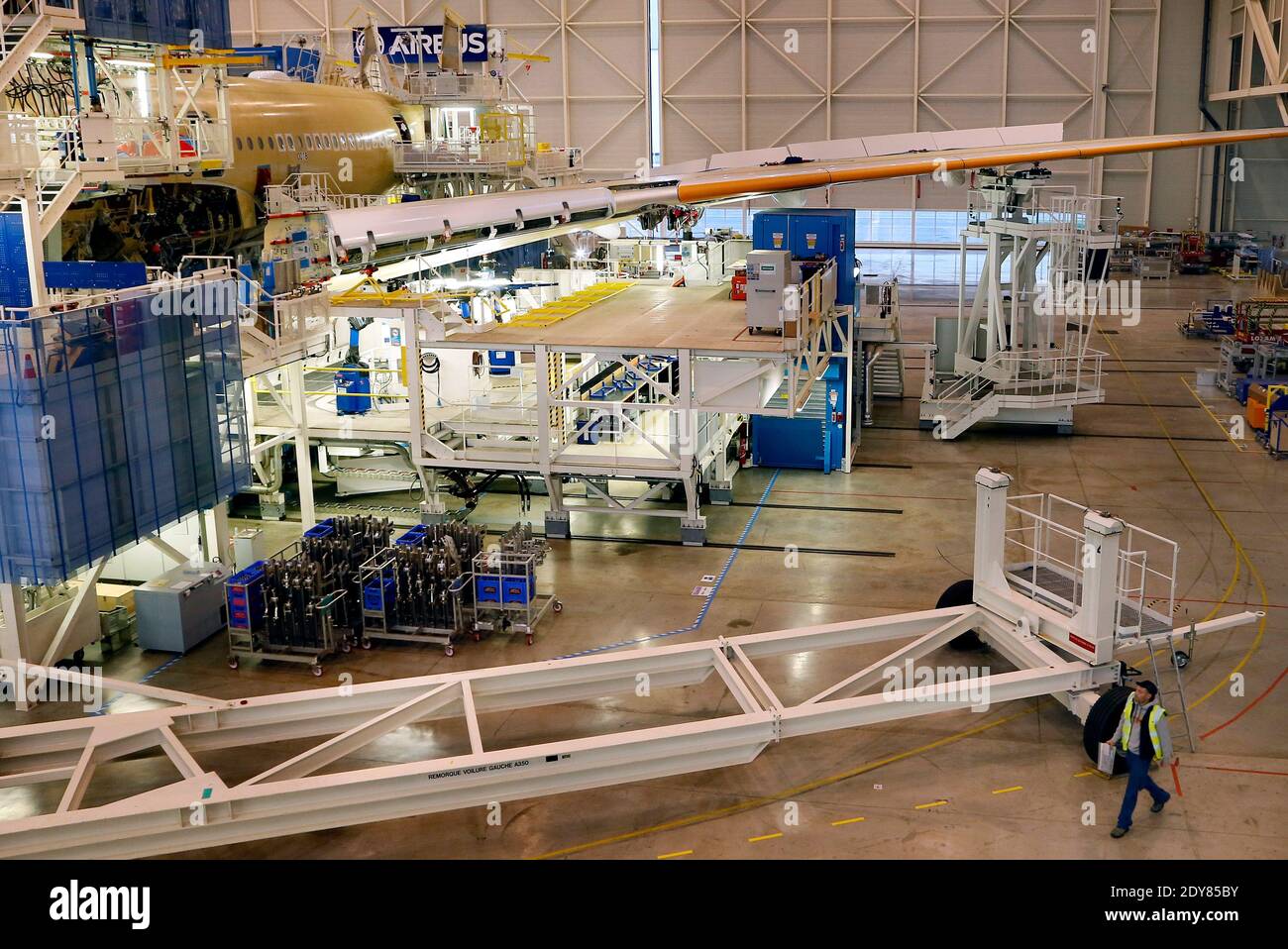 Technicians work on the assembly line of an Airbus A350 at the Airbus ...