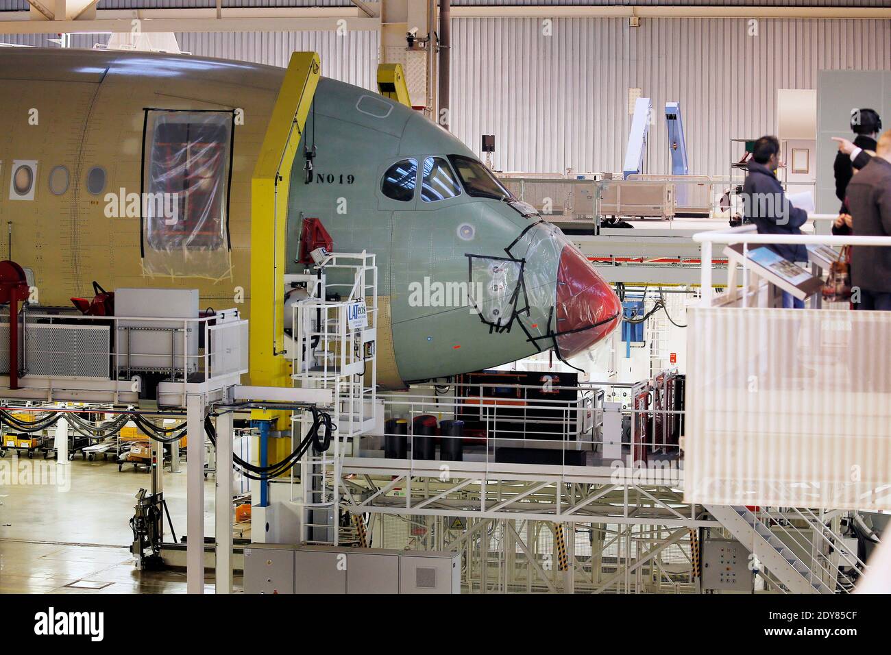 Technicians work on the assembly line of an Airbus A350 at the Airbus ...