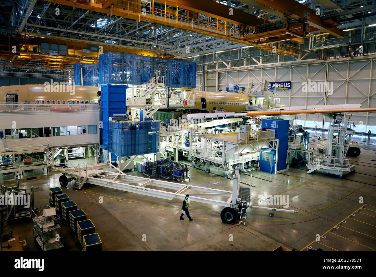 Technicians work on the assembly line of an Airbus A350 at the Airbus ...