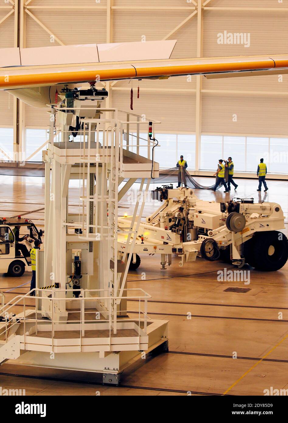 Technicians work on the assembly line of an Airbus A350 at the Airbus ...