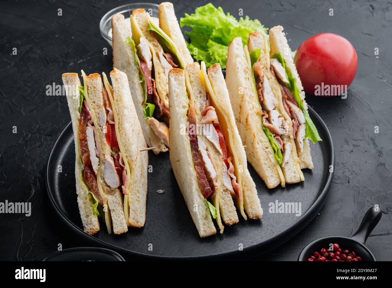 Fresh sandwiches with ingredient, on black background Stock Photo - Alamy