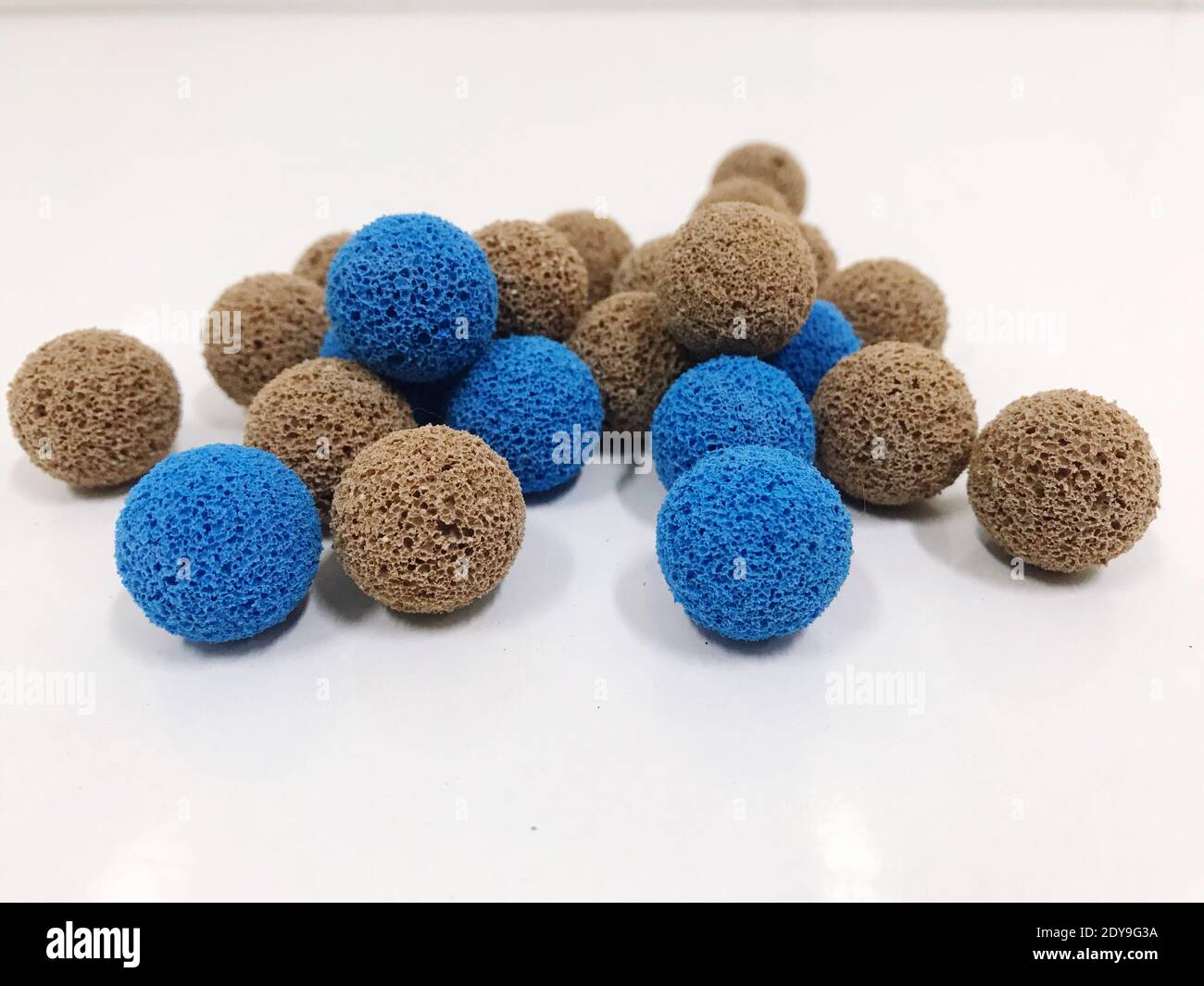 Multi Colored Sponge Balls Against White Background Stock Photo - Alamy