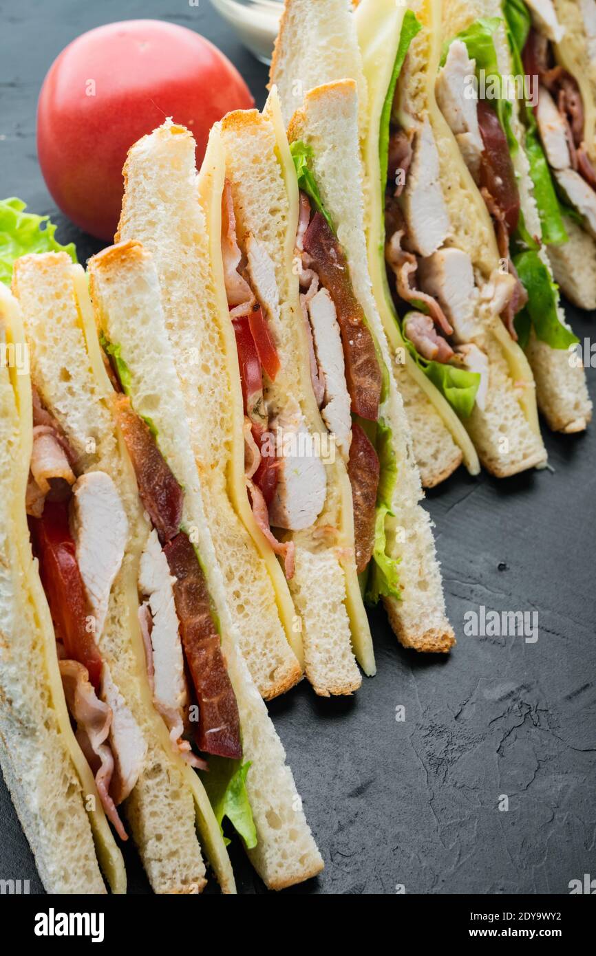 Deli fresh sandwich with chicken, on black background Stock Photo - Alamy