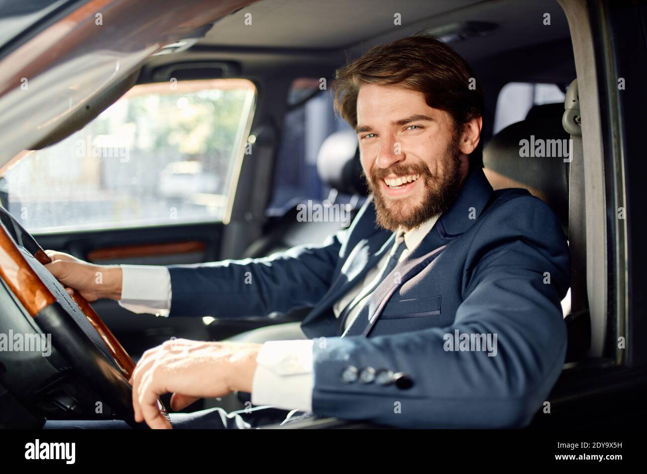 rich man in suit driving car trip road success lifestyle Stock Photo ...