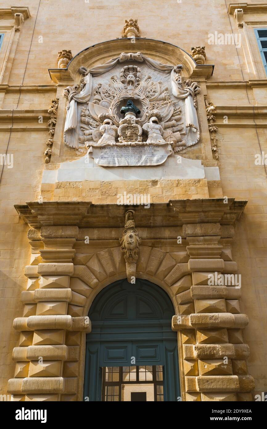 Carved limestone sculptures and architectural details above front ...