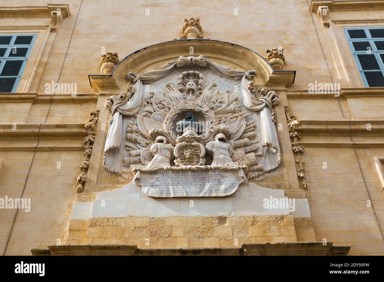 Carved limestone sculptures and architectural details above entrance ...