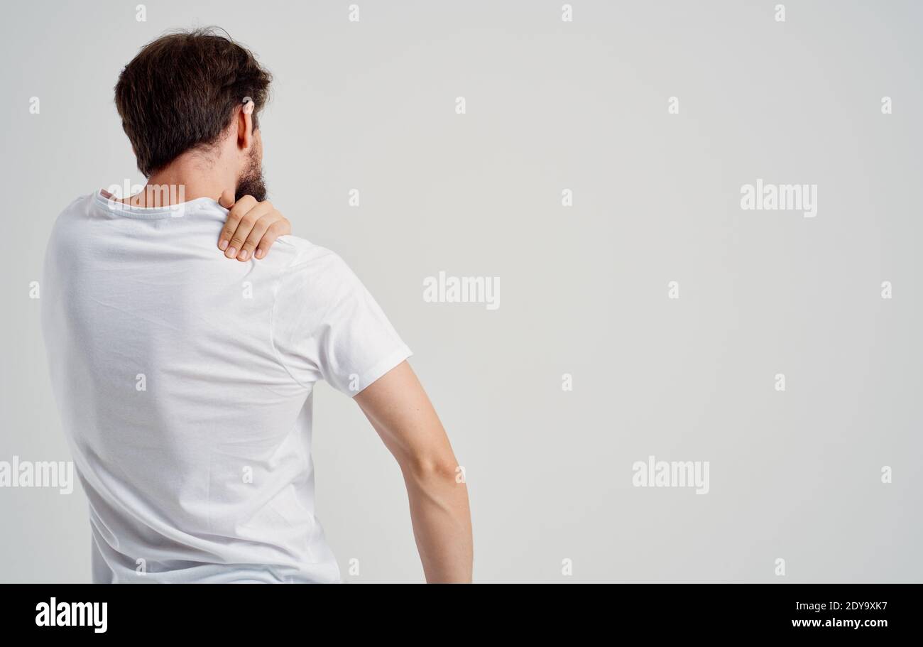 bearded man touching shoulder with hand pain dislocation medical ...