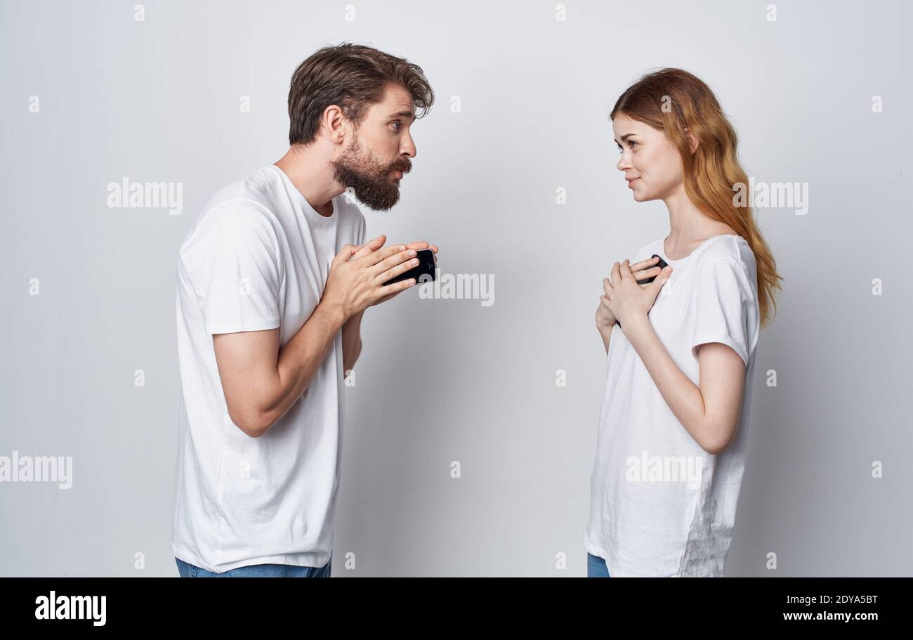 young couple with phones technology communication friendship lifestyle ...