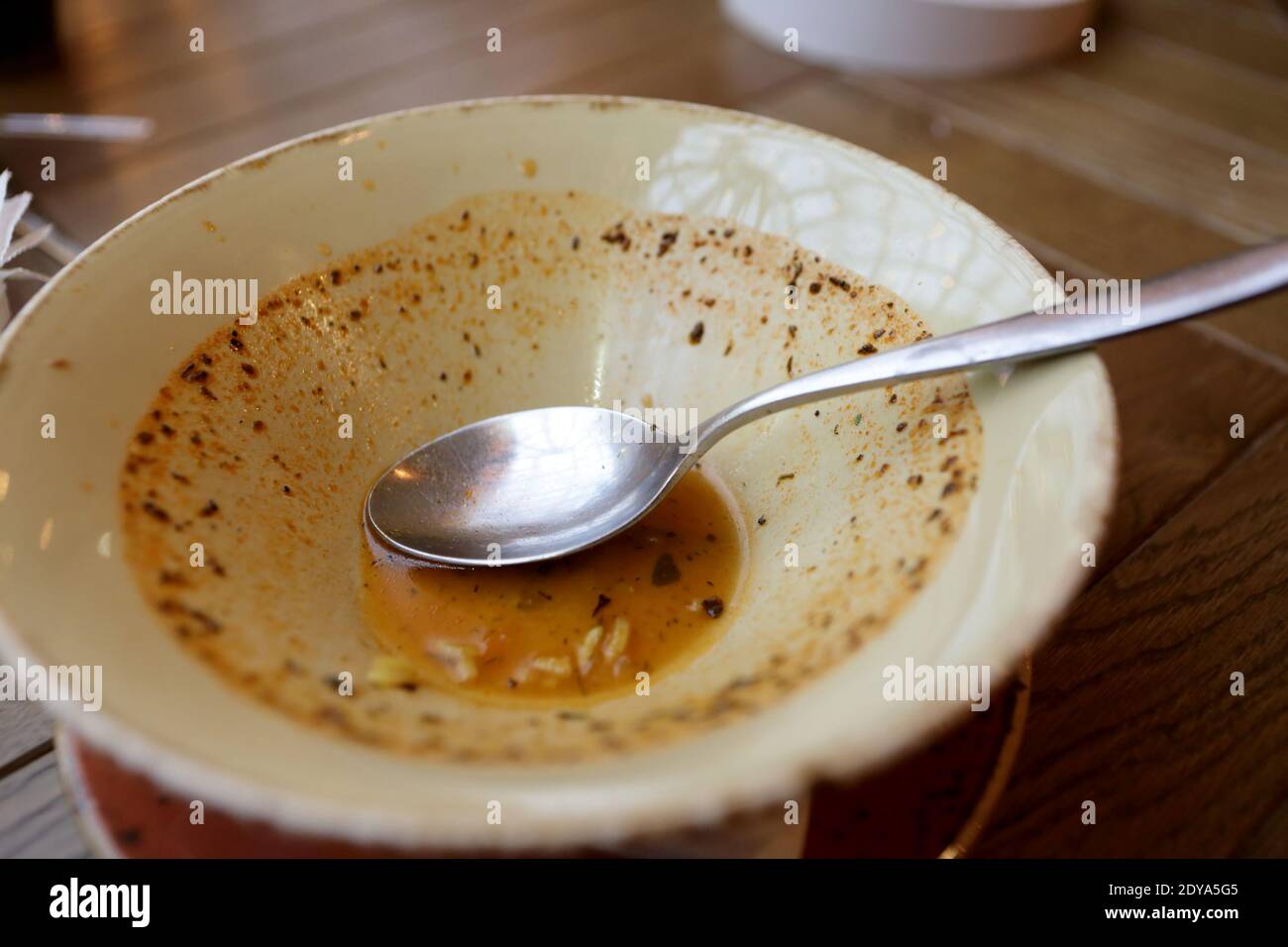 Plate of soup remains in a restaurant Stock Photo - Alamy