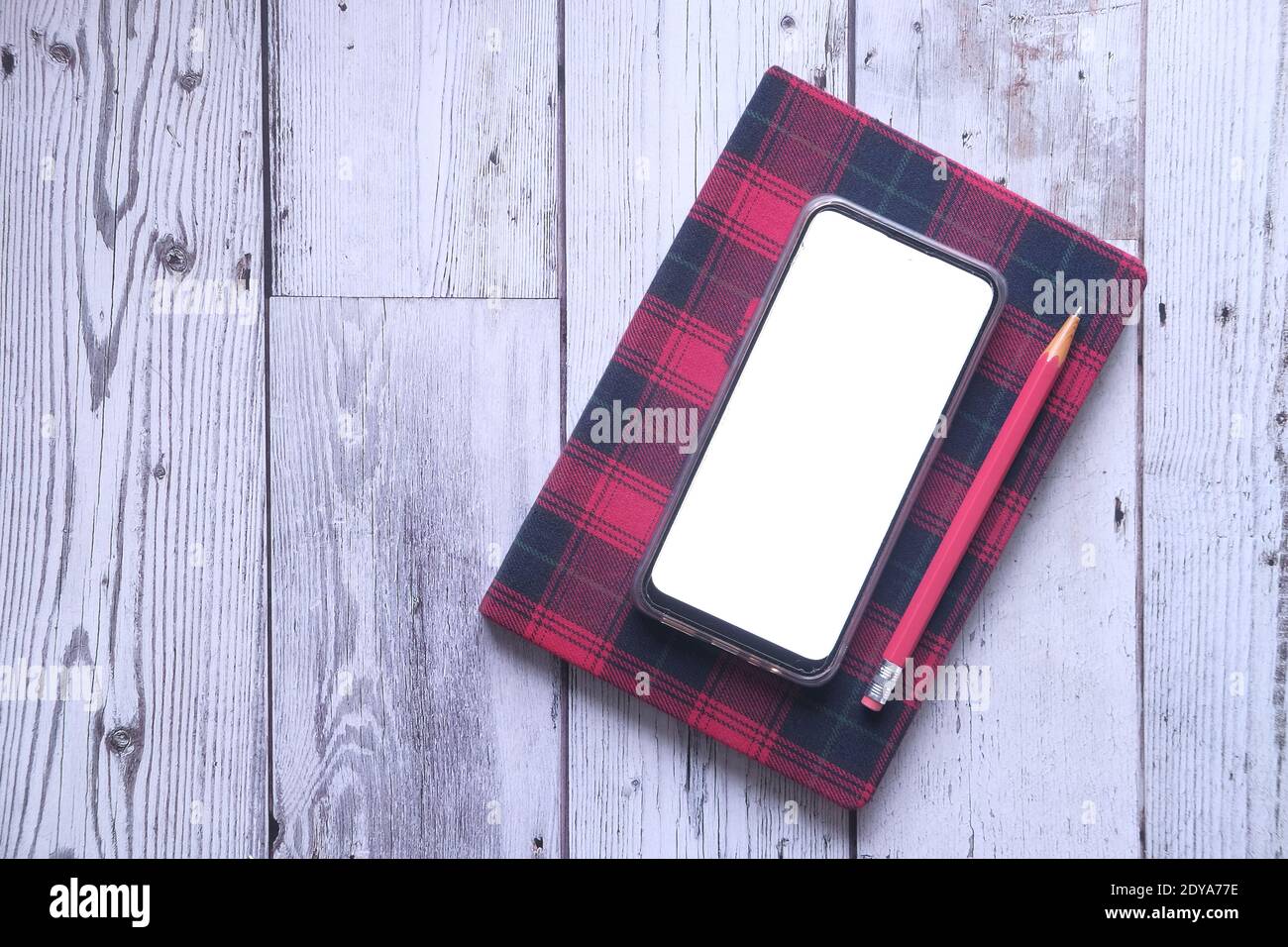 smart phone with empty screen on notepad Stock Photo - Alamy