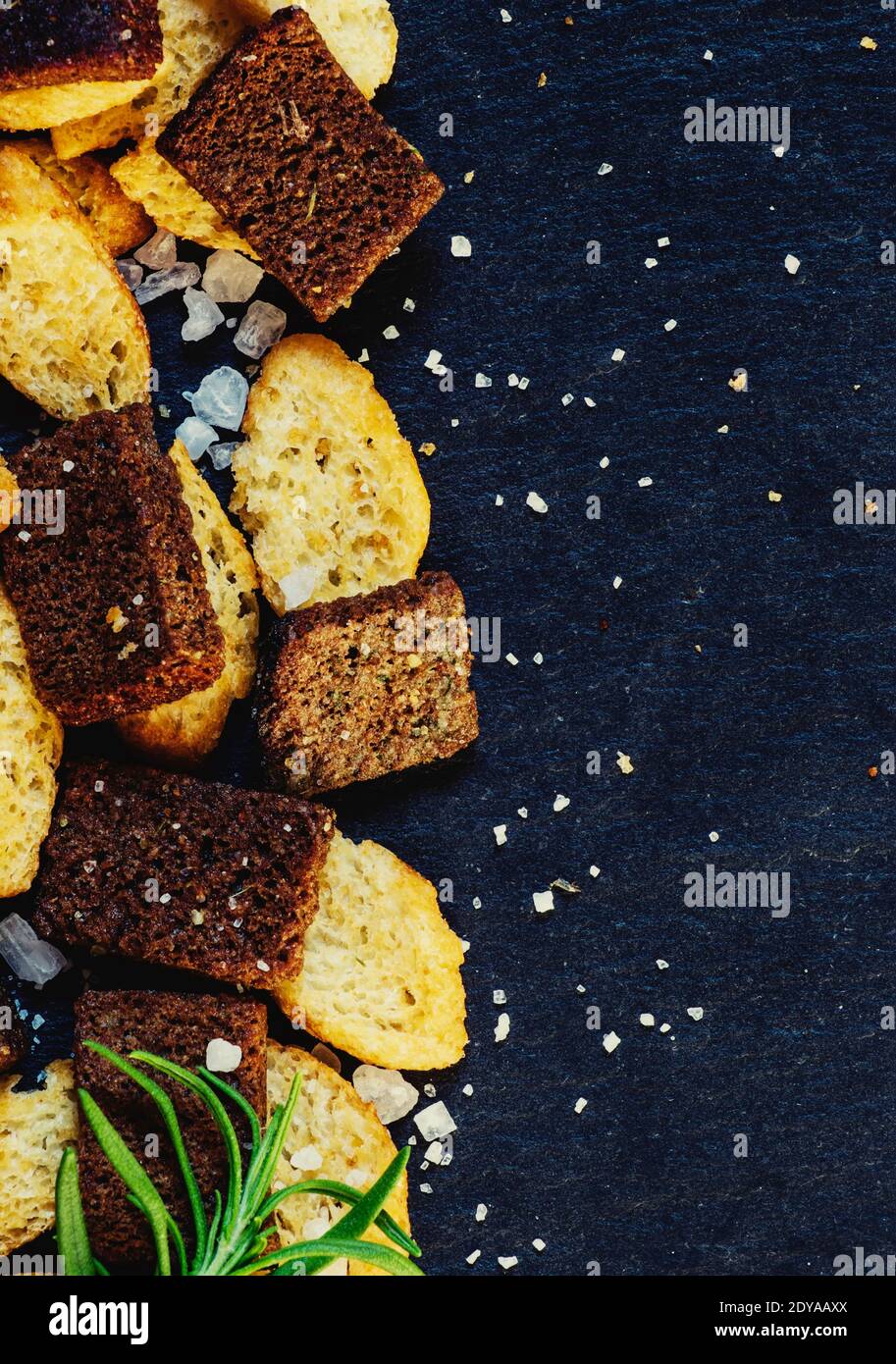Salty spicy crunches, dark background, top view Stock Photo - Alamy