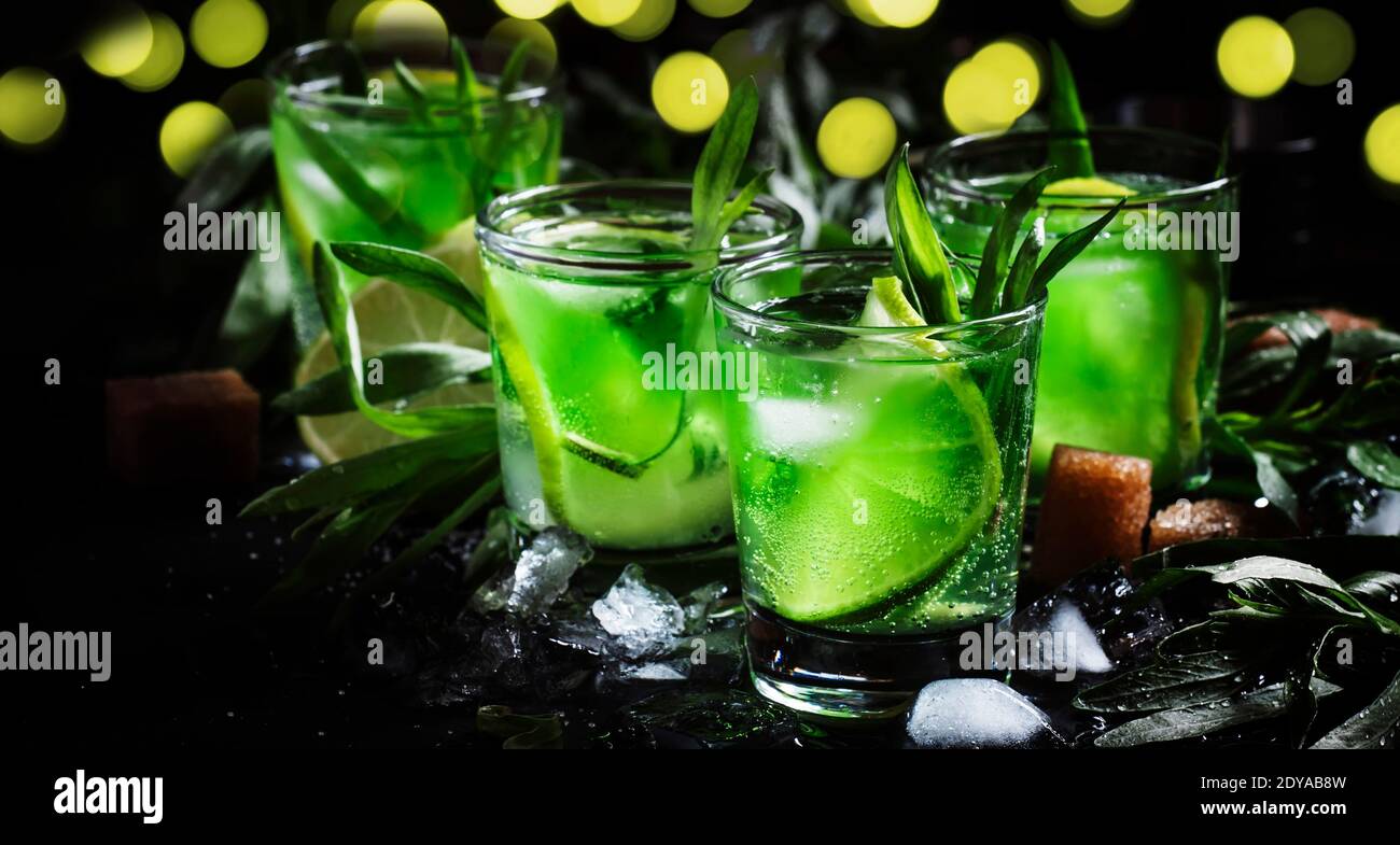 Alcoholic green cocktail with lime, lemon juice, cane sugar, soda ...