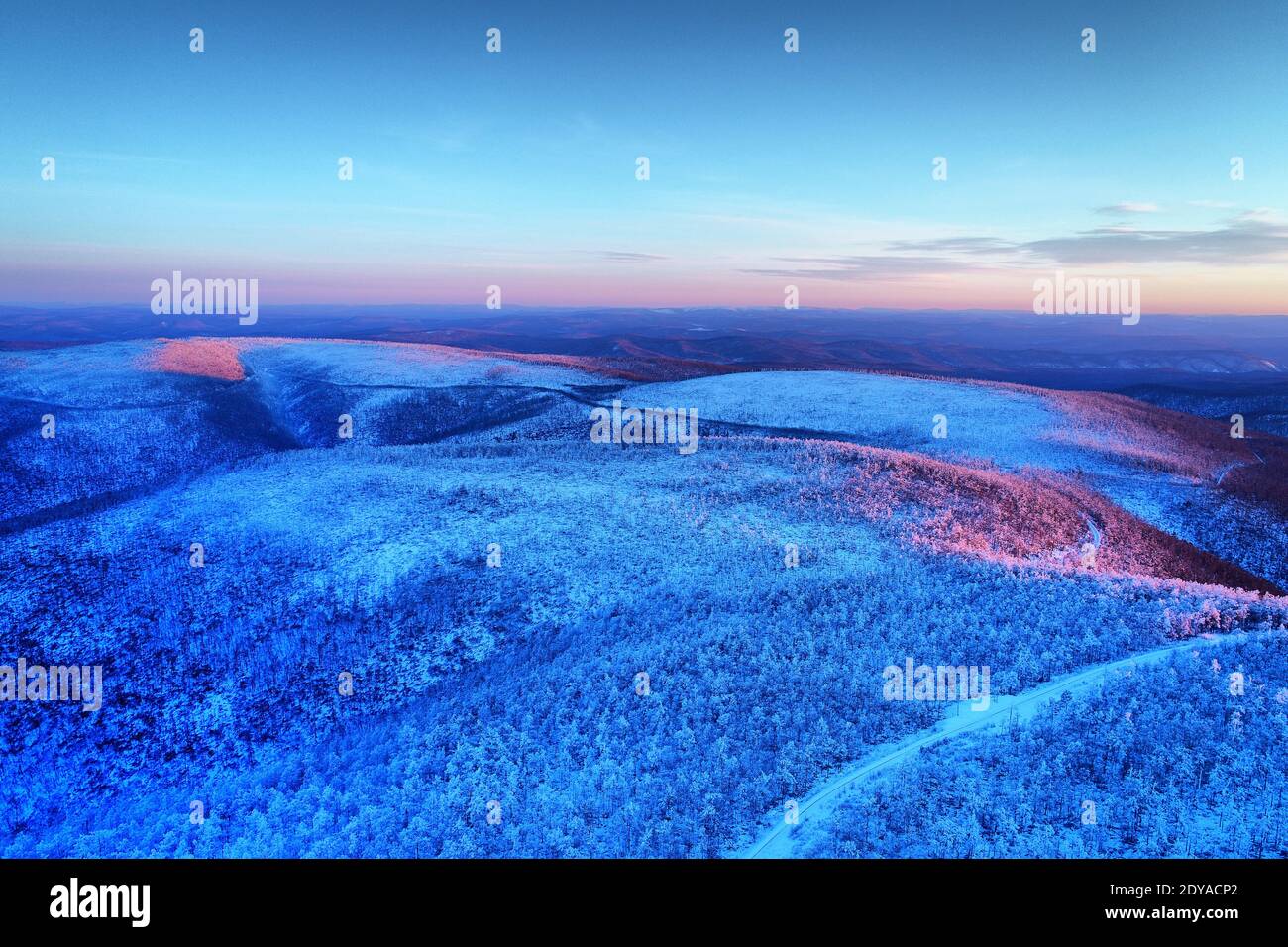 An aerial view of the snow-covered primeval forest of the Greater Khingan Range in north China's ...