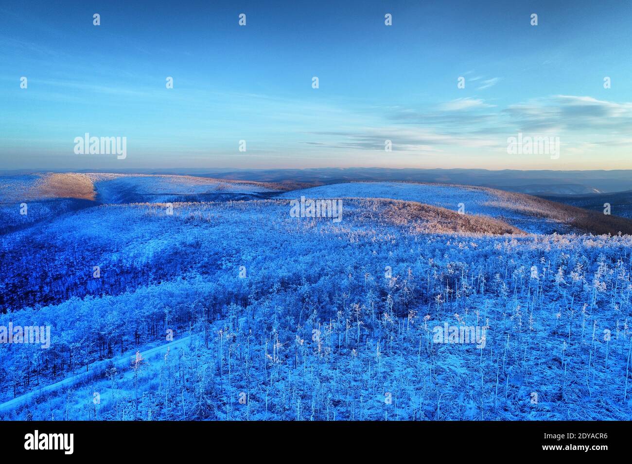 An aerial view of the snow-covered primeval forest of the Greater Khingan Range in north China's ...