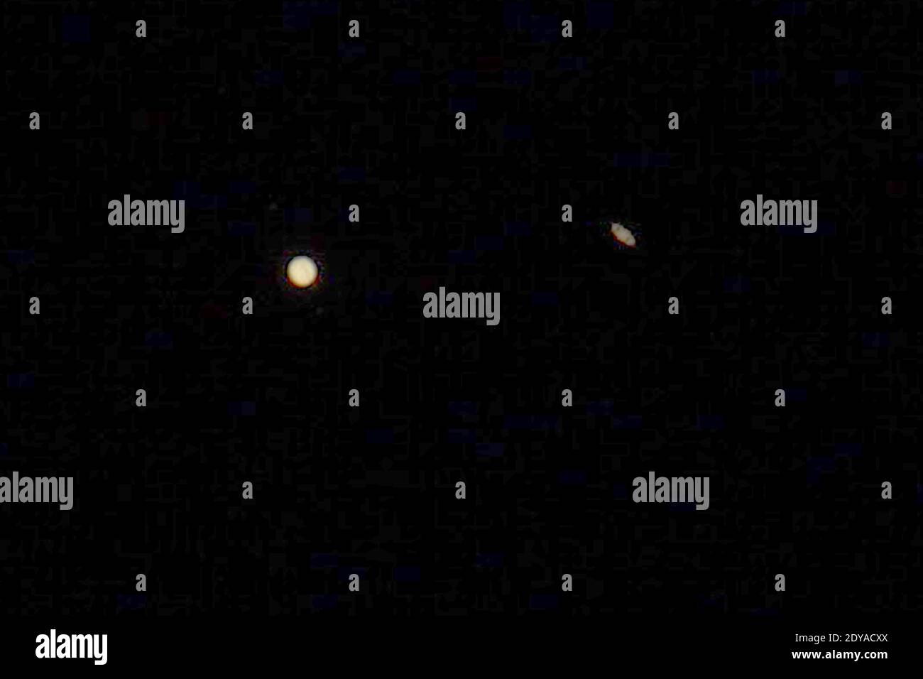 Jupiter (left) and Saturn are seen in the sky, Monday, Dec. 21, 2020 ...