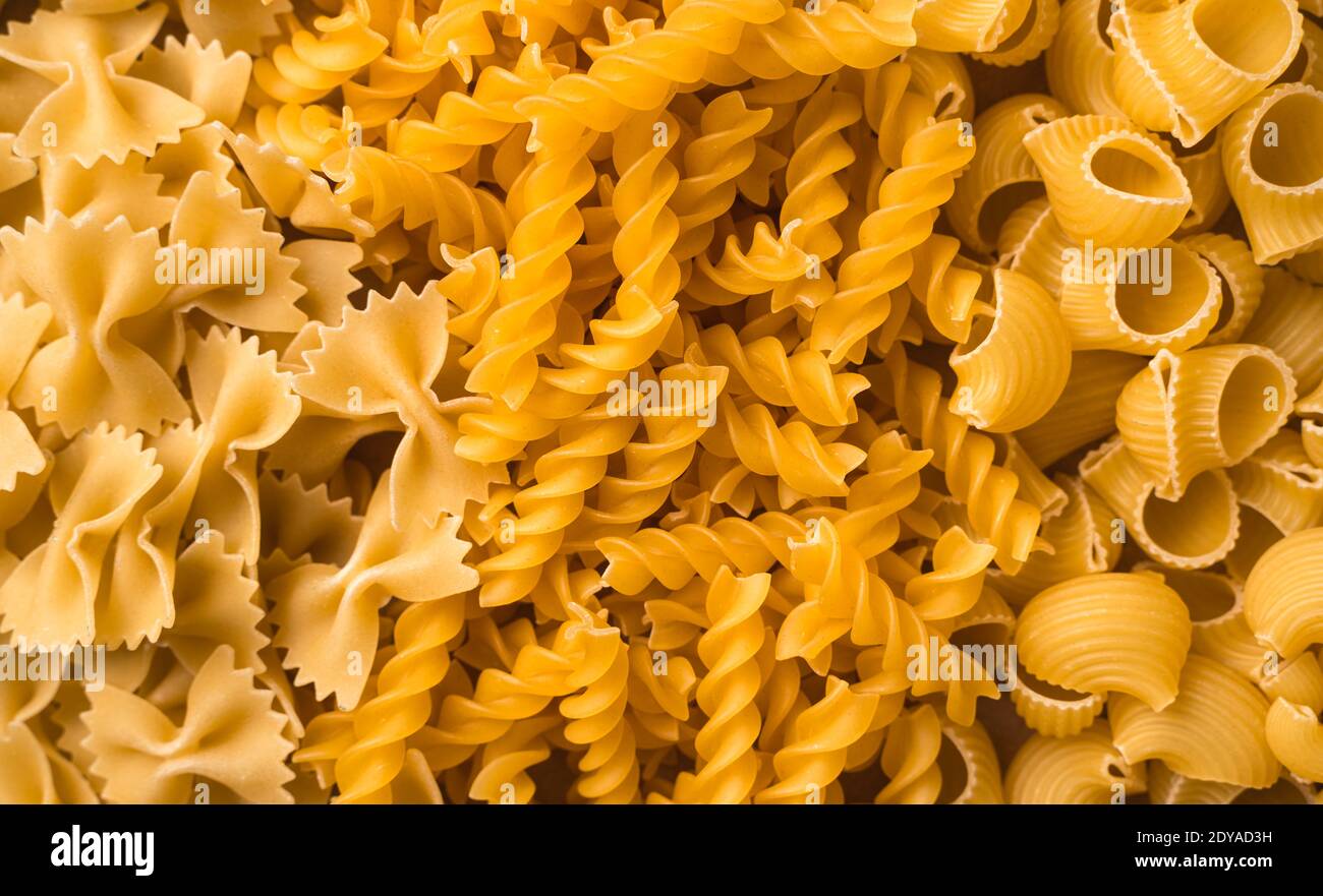 Raw pasta of different types close-up, top View Stock Photo - Alamy