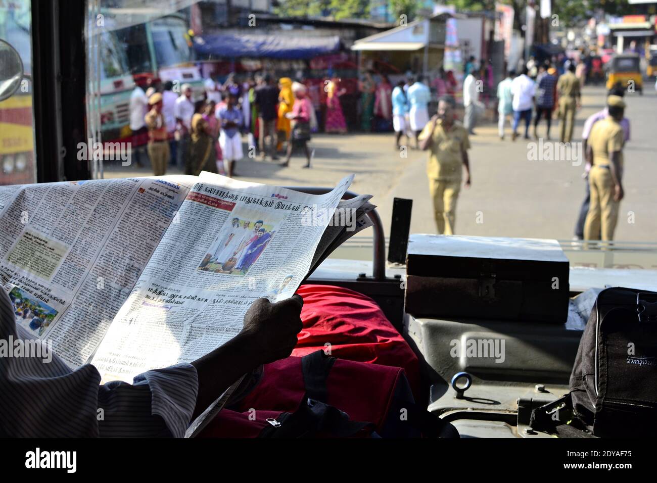 Sulthan Bathery, Kerala, India - January, 2017: Bus driver reading ...