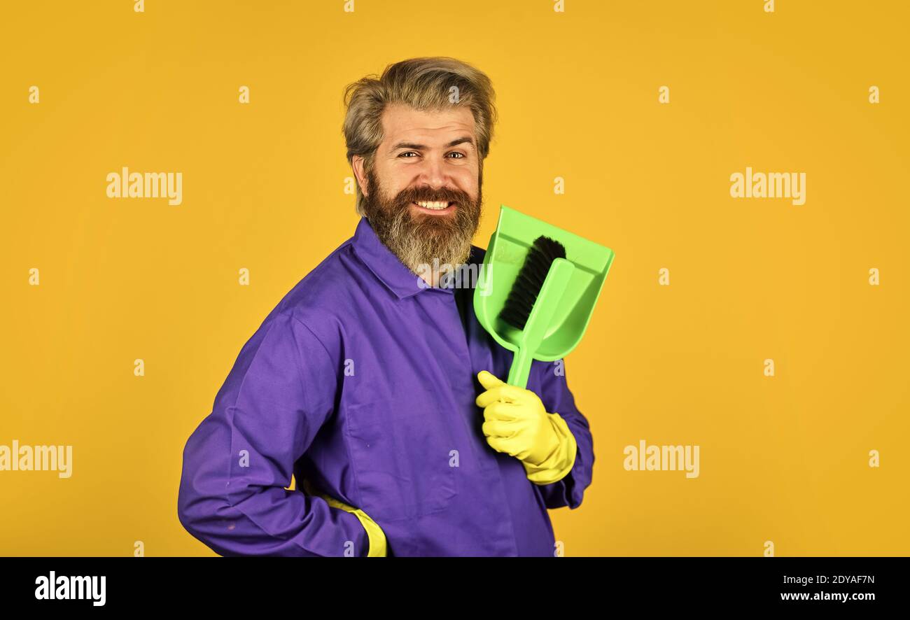 Man cleaning home with broom. Janitor man sweeping. spring cleaning ...