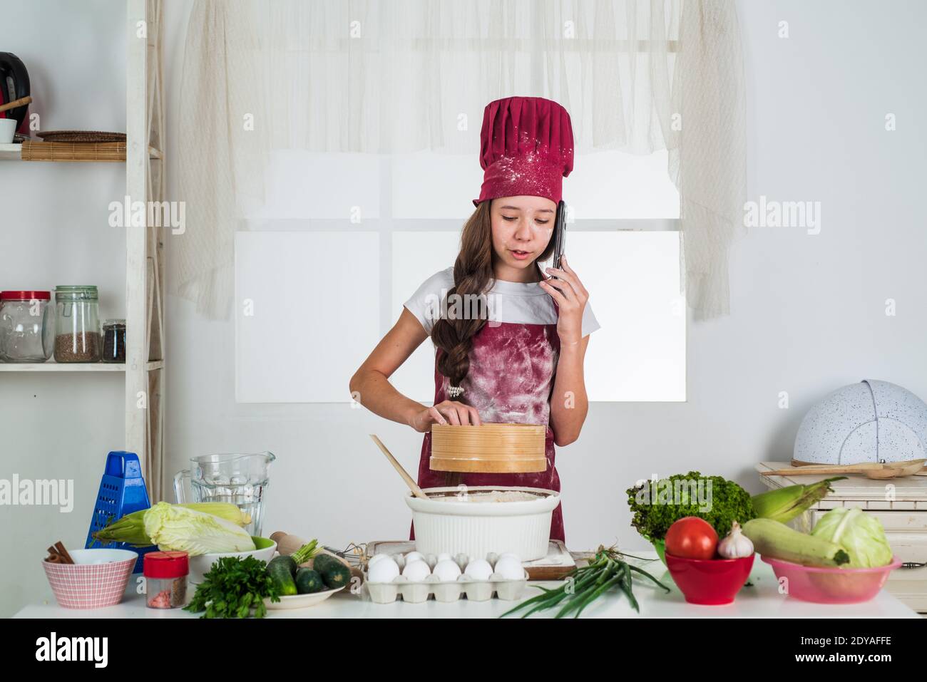 child prepare healthy food at home and wearing cook uniform ...