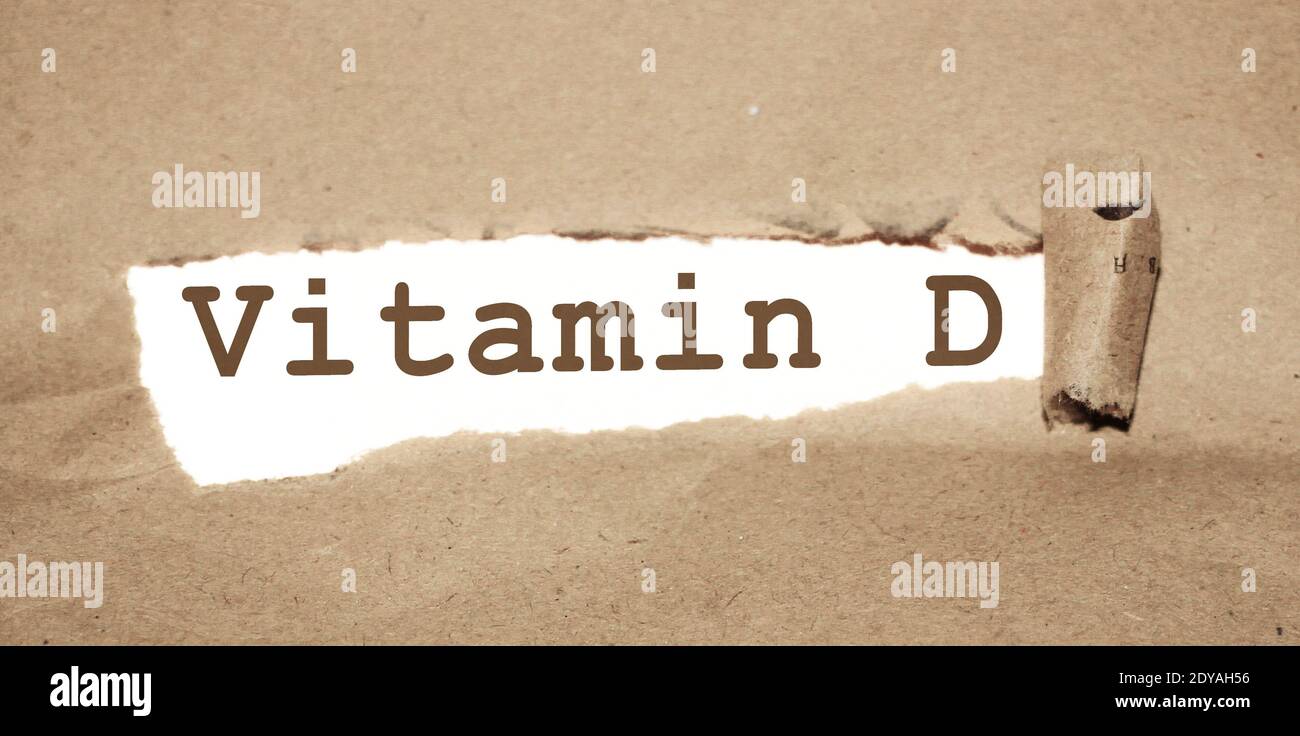 vitamin d written under torn brown paper. Healthcare concept Stock ...