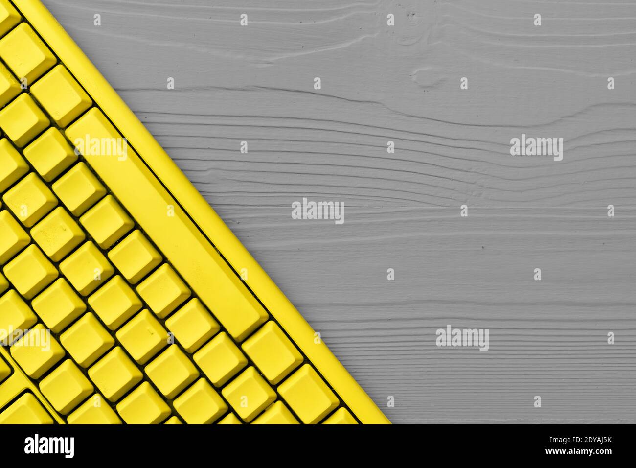Yellow computer keyboard on gray background top view Stock Photo - Alamy