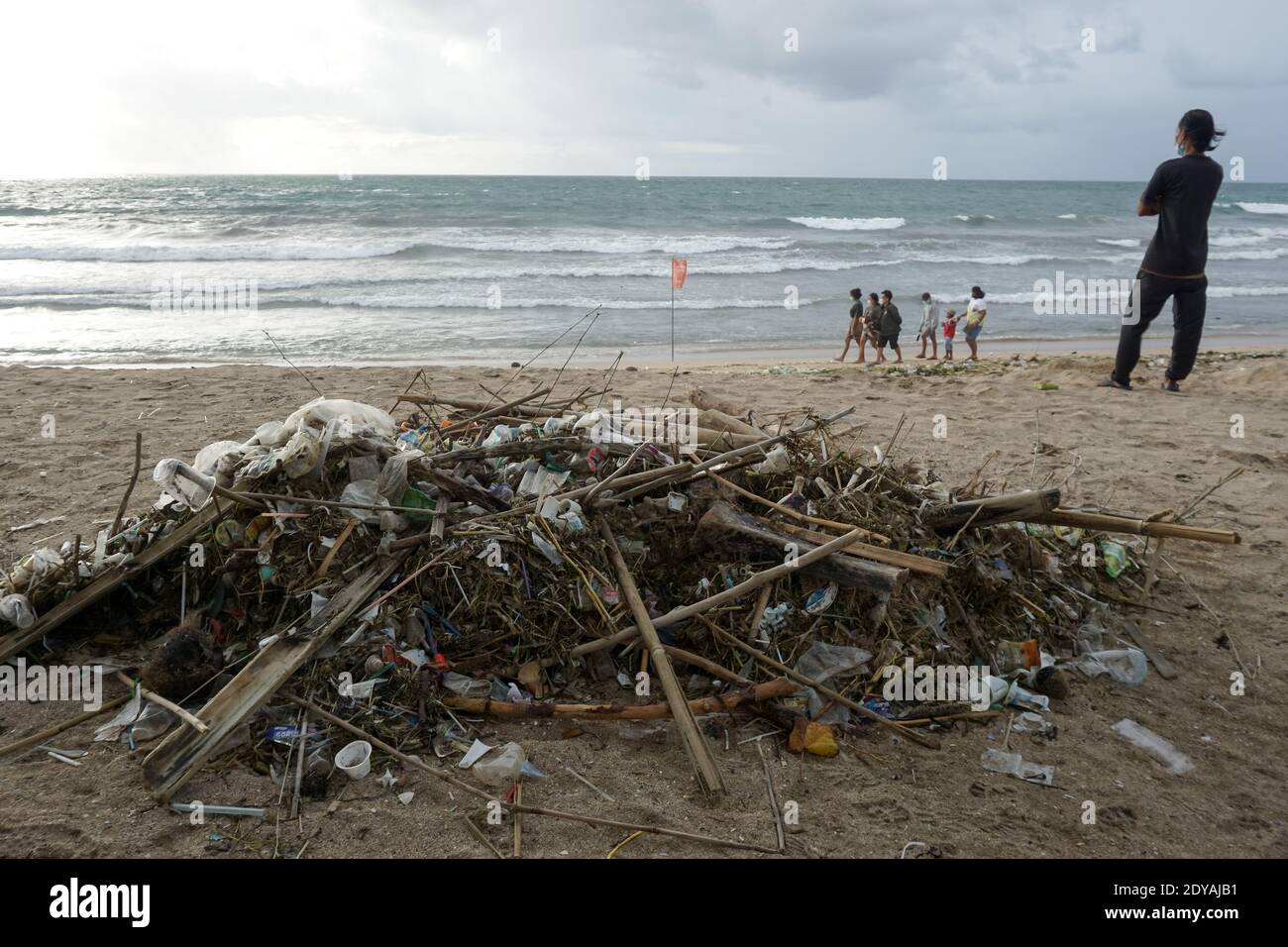 Tourists are seen along the beach among the trashes.Tons of Trash ...
