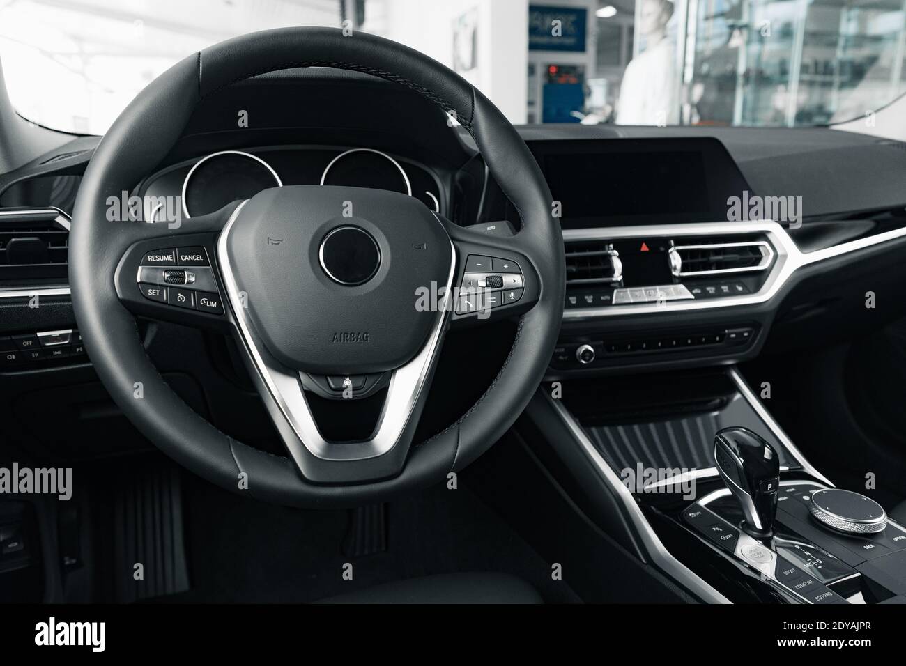 Steering wheel of a new luxury car Stock Photo - Alamy