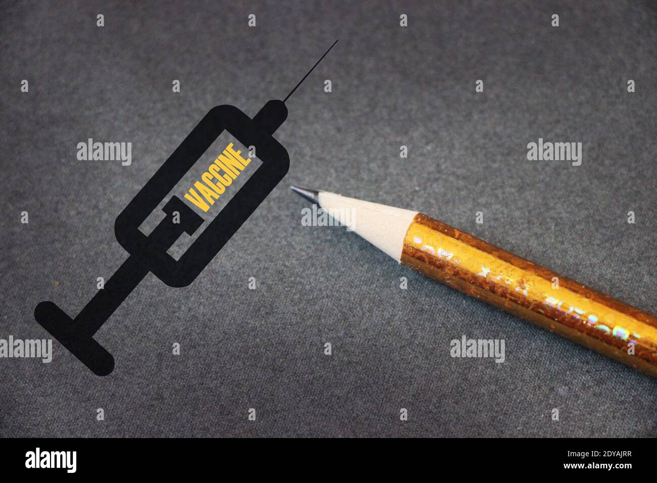 Syringe sign with word vaccine and golden pencil. Medication Healthcare ...