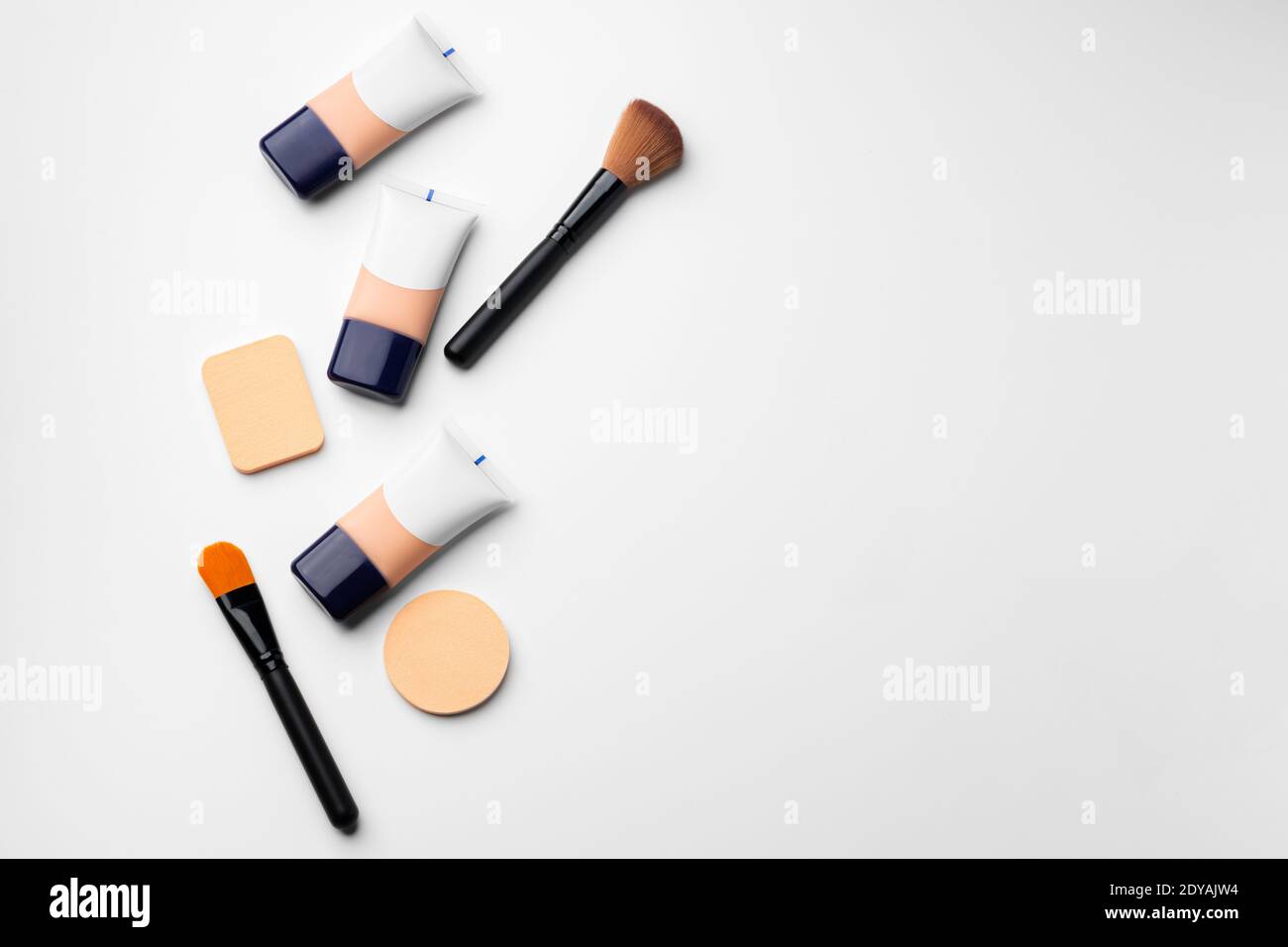 Make up liquid foundation with brush on white background Stock Photo ...