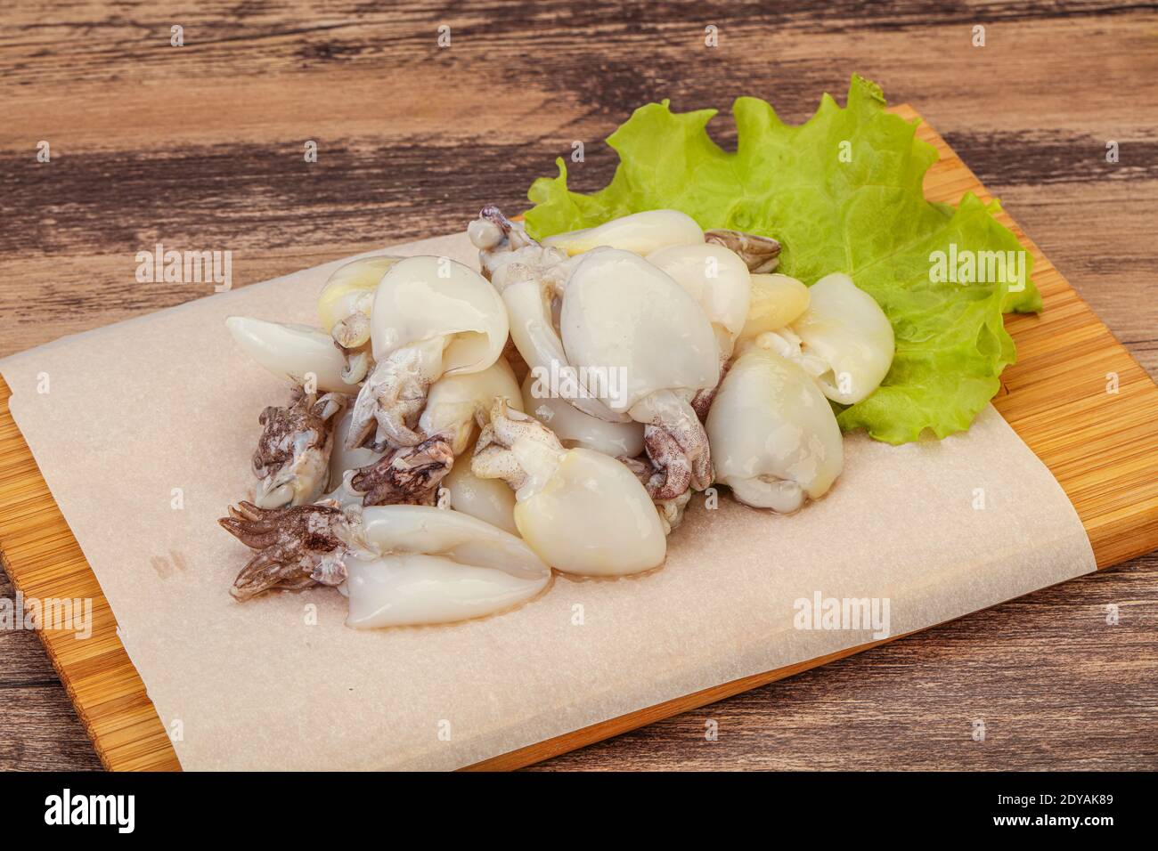 Raw seafood - cuttlefish for cooking over board Stock Photo - Alamy
