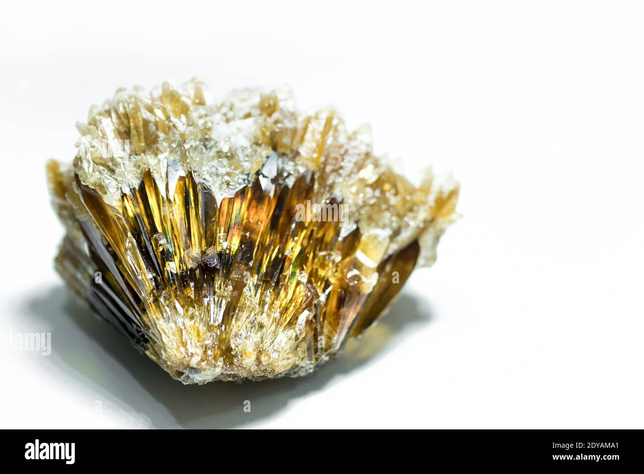 Golden yellow calcite isolated on the white background Stock Photo - Alamy