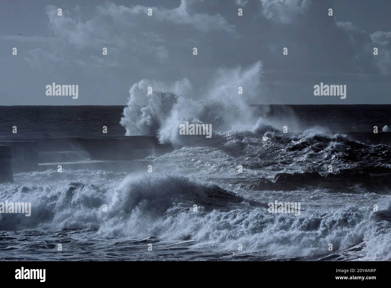 Wave splash. Douro river south pier in a stormy day. Used infrared ...
