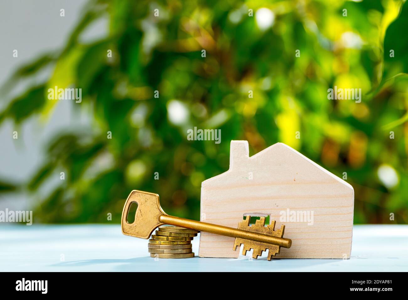 Wooden toy house and house keys close up Stock Photo - Alamy