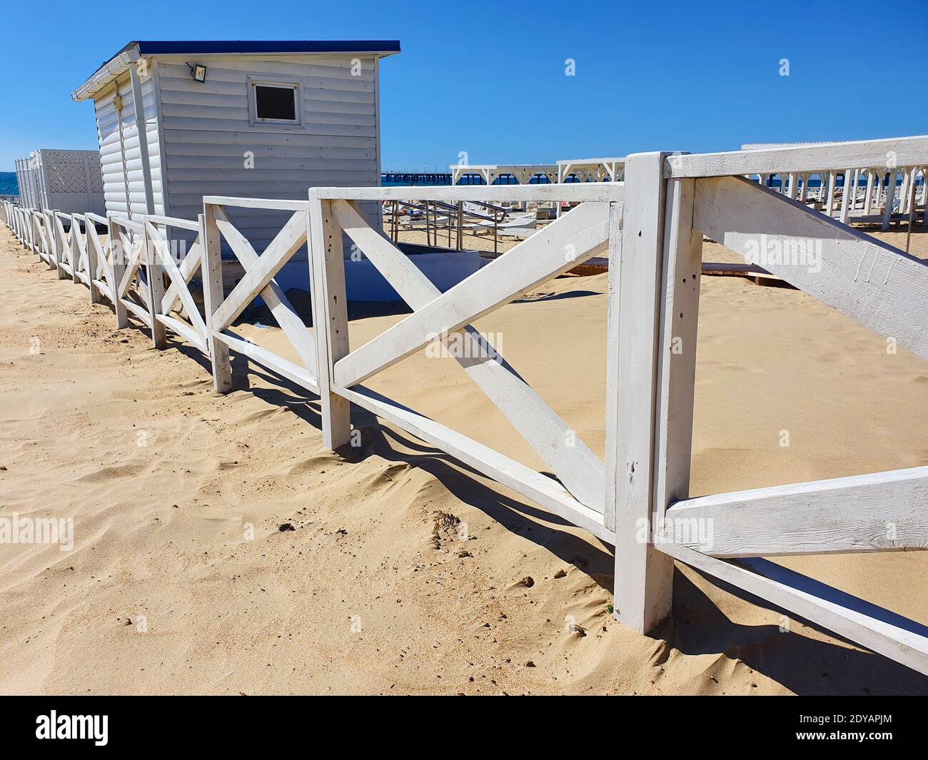 White fence and beach house by the ocean Stock Photo - Alamy
