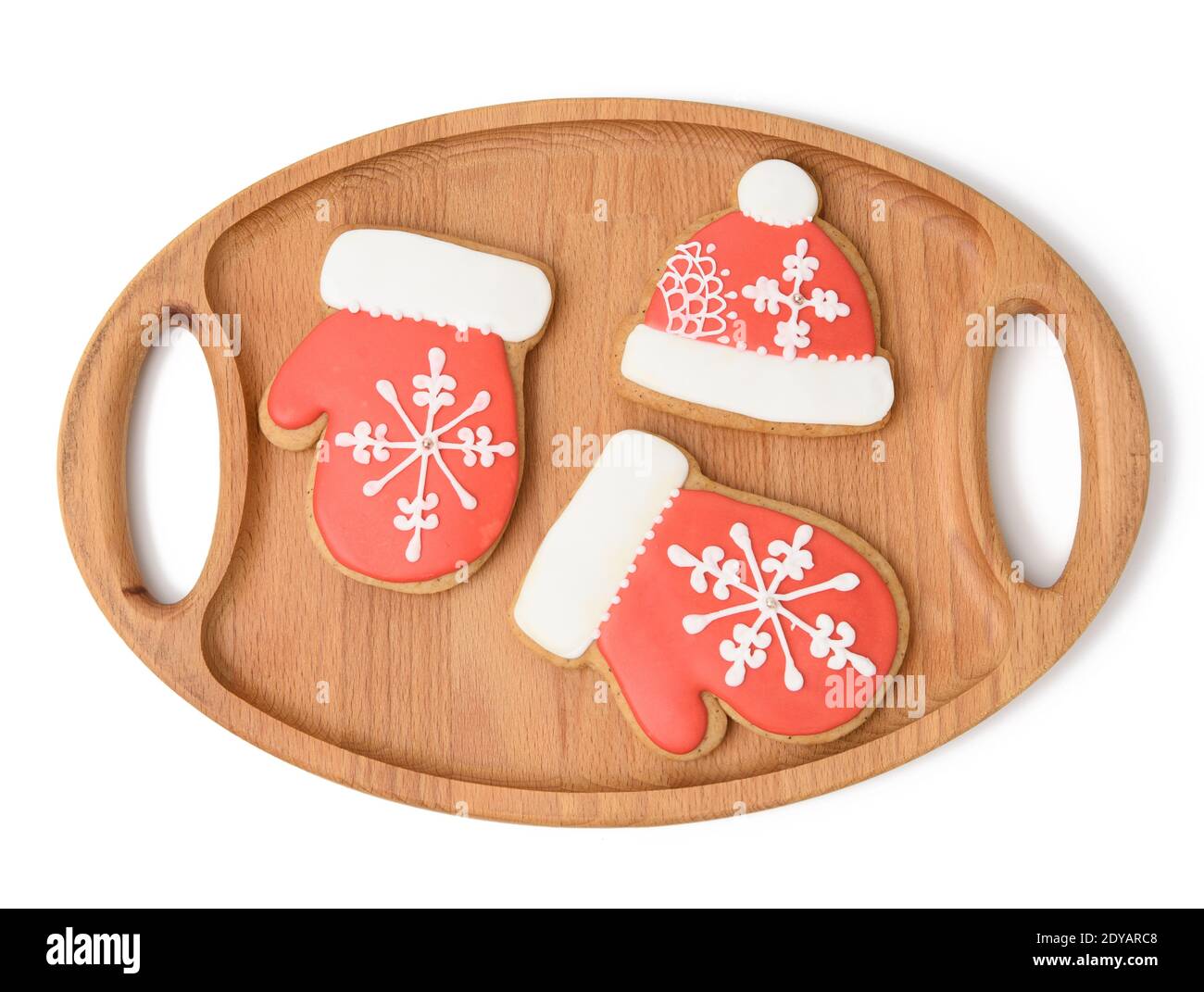 baked gingerbread in the shape of a mitten and covered with red icing ...