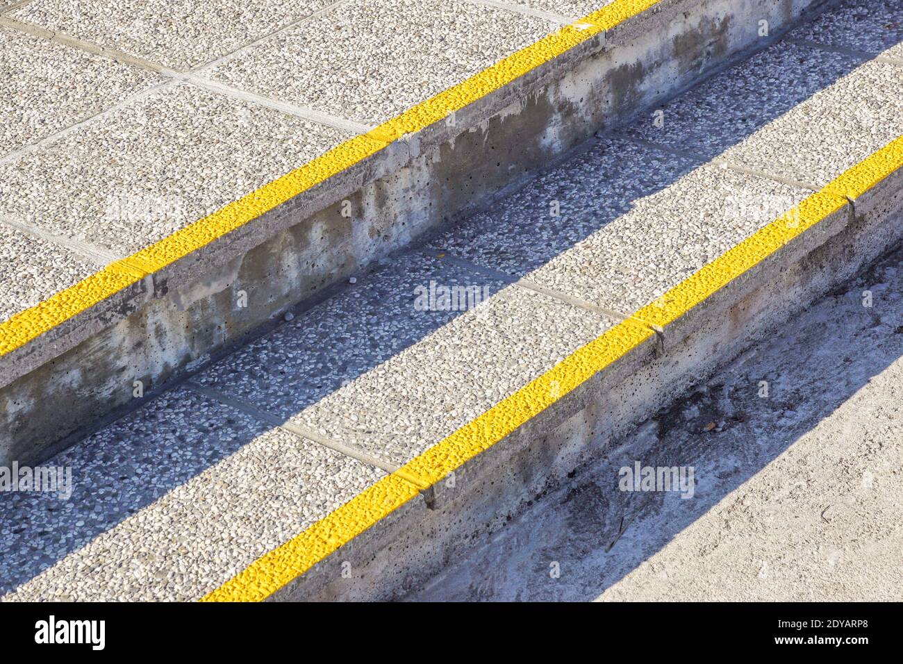 Yellow line at sidewalk with a concrete stairs curbstone Stock Photo ...