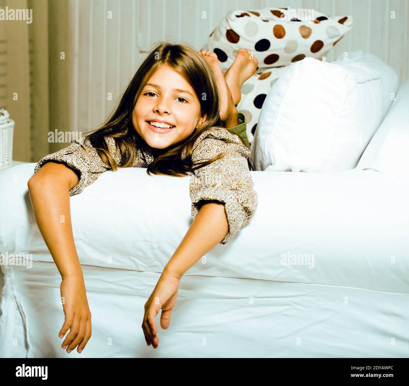 little cute brunette girl at home interior happy smiling close up ...