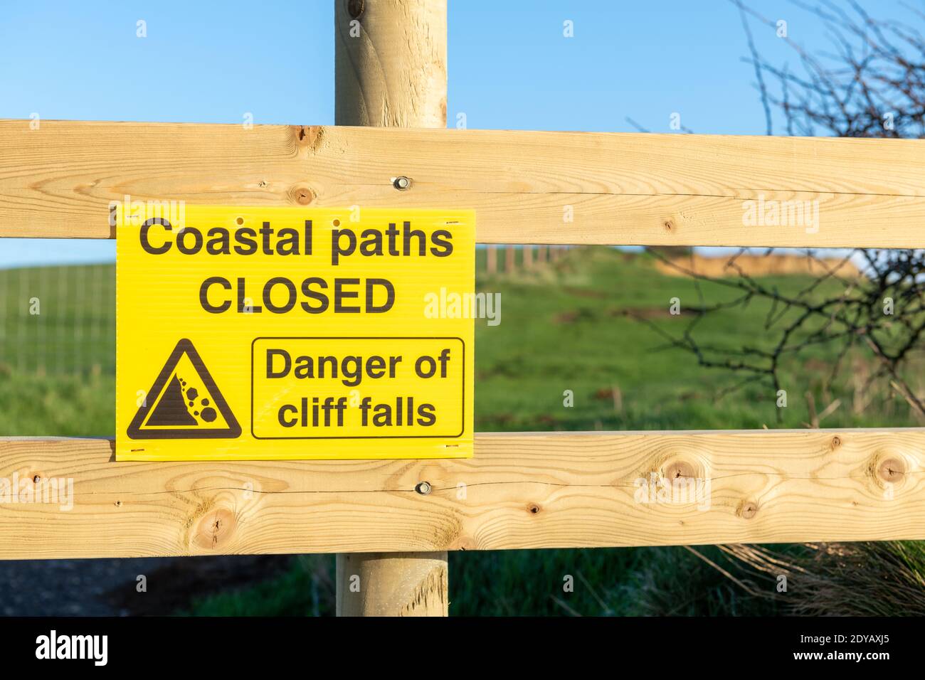 Close up of a warning sign alerting walkers about a dangerous landslide ...