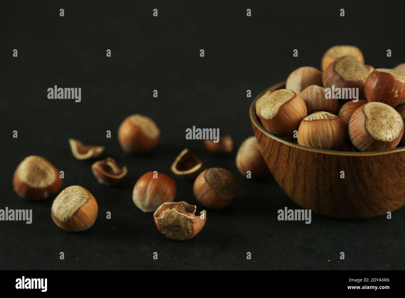 Hazelnuts on wooden backdrop. Hazelnut background. High quality photo ...