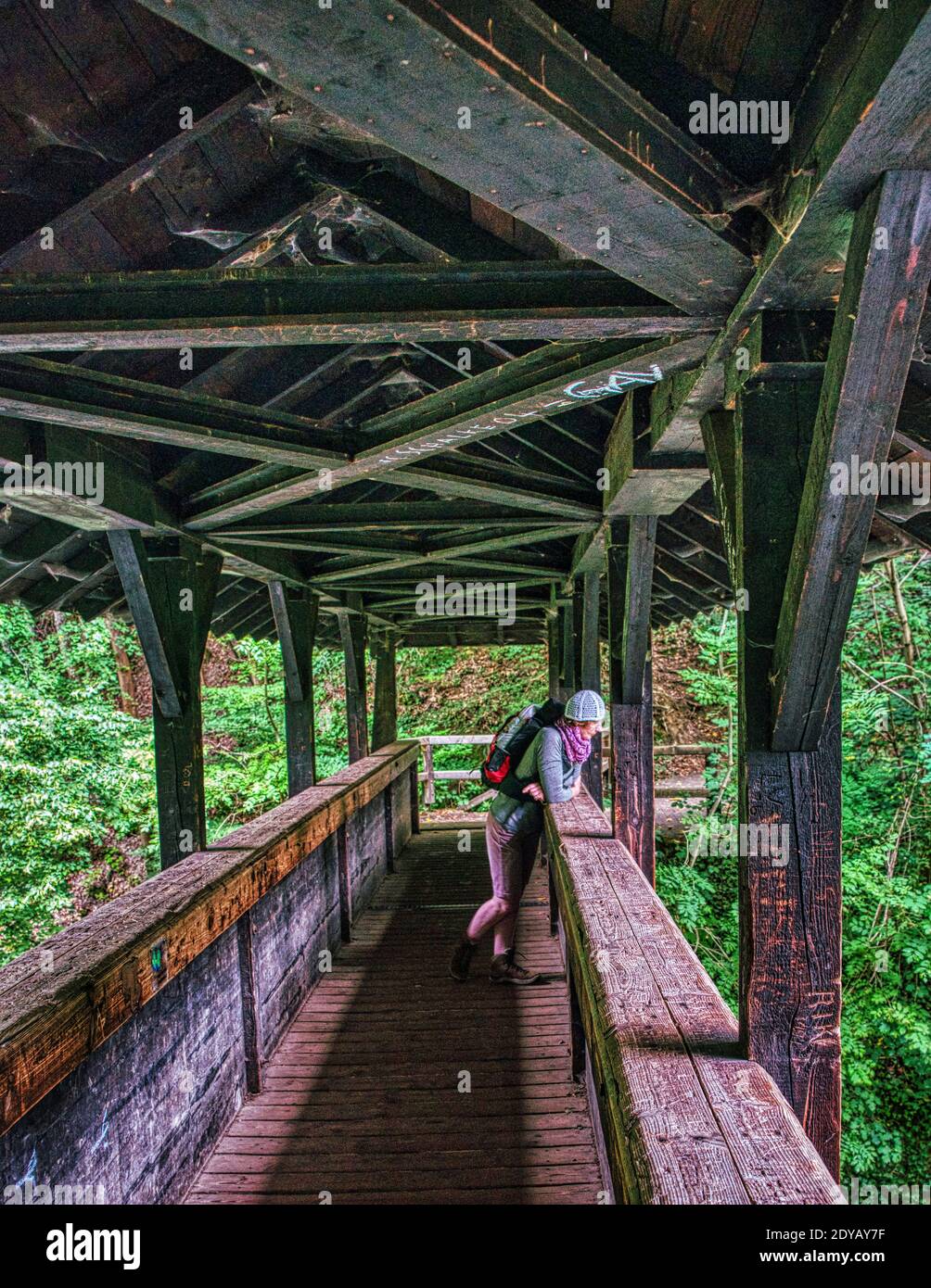 Senior woman walking footbridge hi-res stock photography and images - Alamy
