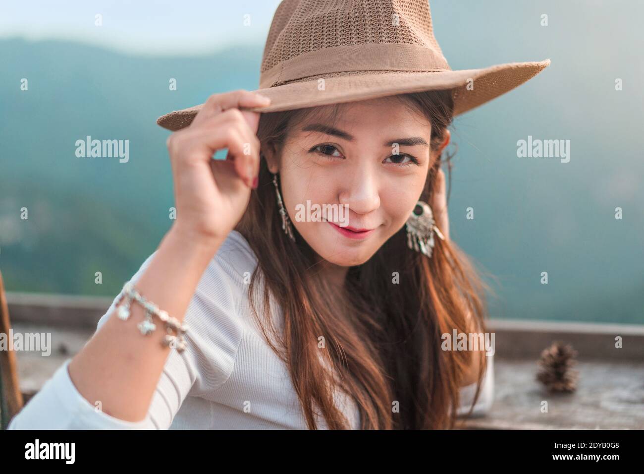 Asian woman wearing cowboy hat hi-res stock photography and images - Alamy