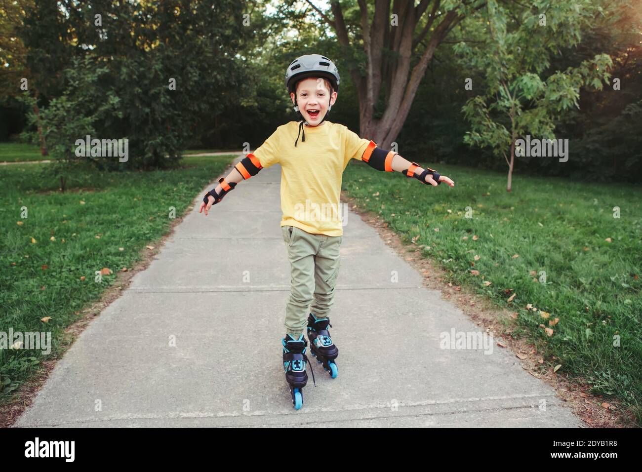 Boy inline skating outdoors hi-res stock photography and images - Alamy