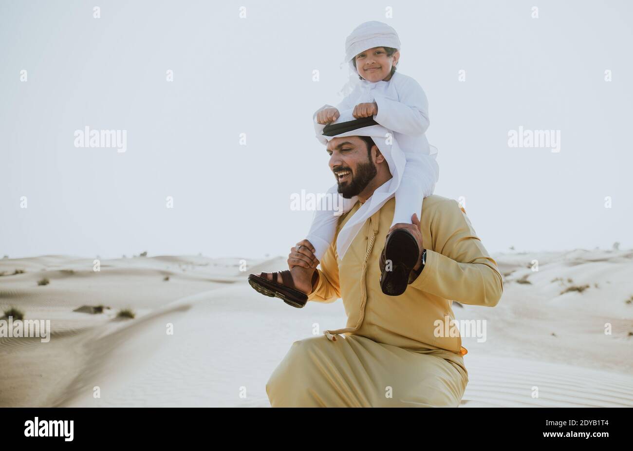 Father carrying son arab hi-res stock photography and images - Alamy
